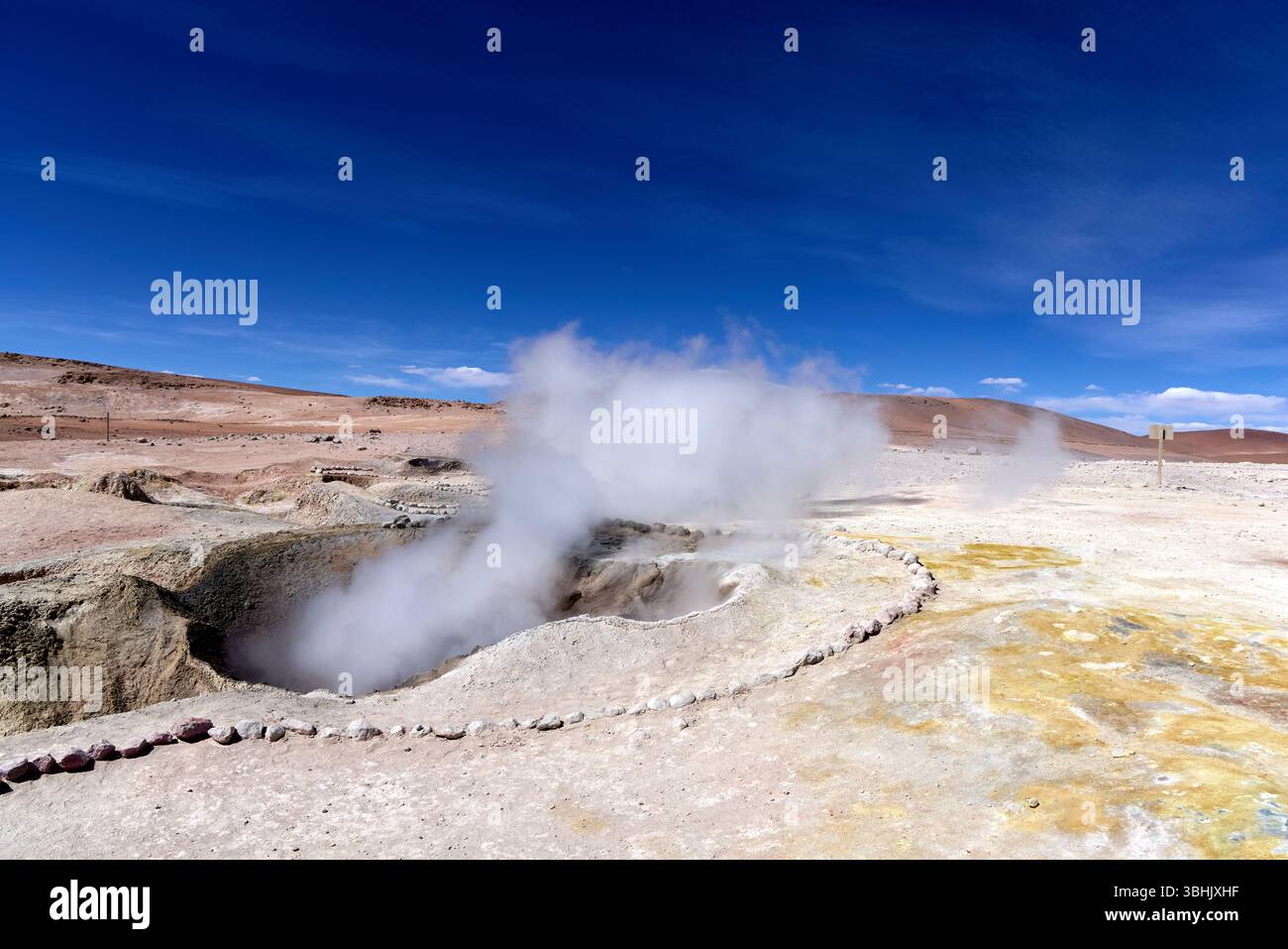 Active geothermal field with steam vents and yellow sulfur deposits in ...