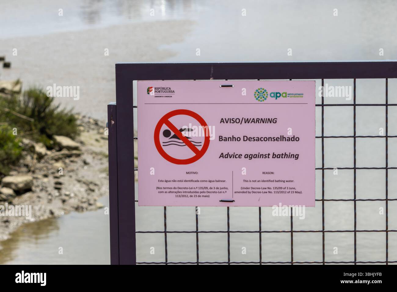 Warning sign prohibiting bathing in a river in portugal due to ...