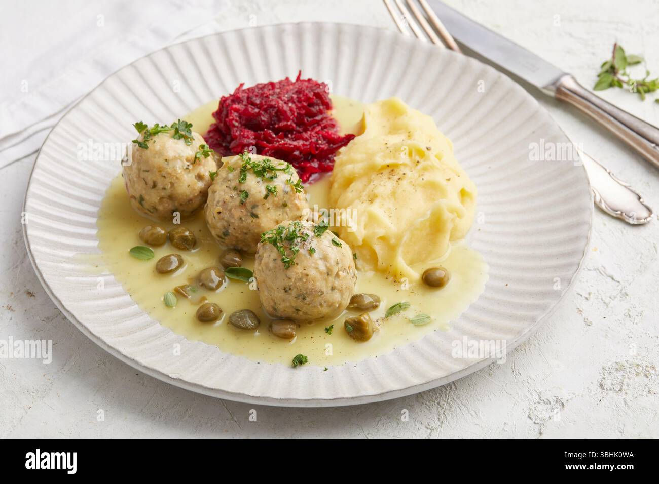 German meatballs in creamy caper sauce. Traditional German meatballs ...