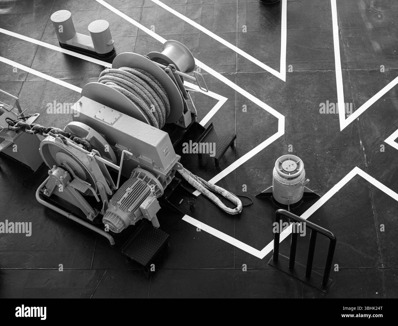 Deck markings with electric winch and mooring line on the foredeck of a ...