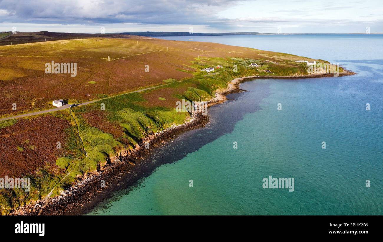 Aerial shot of Waulkmill Bay, Orkney at high tide with view out towards ...