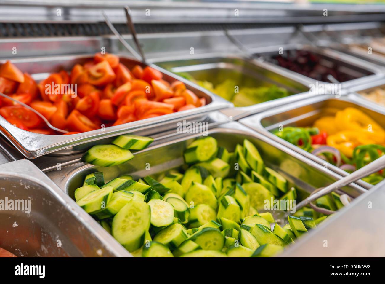 Fresh Salad Bar with Assorted Vegetables in a Buffet Setting Stock ...
