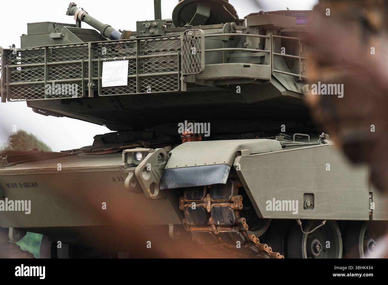 A U.S. Army Soldier assigned to 1st Cavalry Division, waits to drive an ...