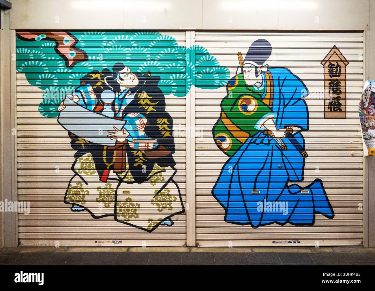 painted shuttered gates of a closed storefront in Asakusa Tokyo Japan ...