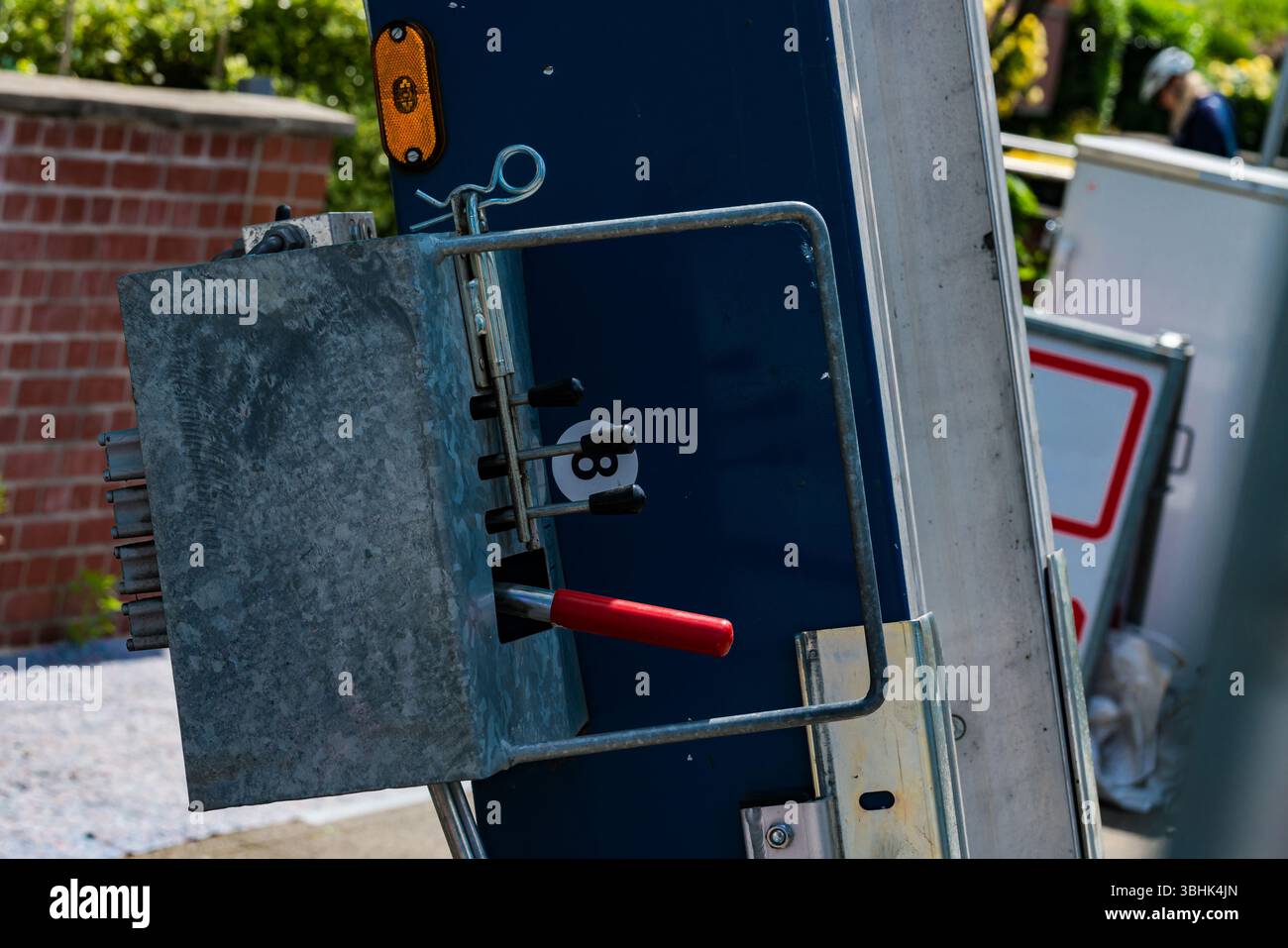 Metal control panel with levers and switches stands prominently at a ...