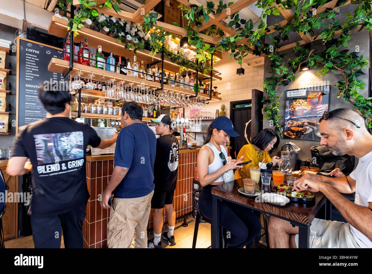 Coffee shop interior, staff and customers, Wan Chai, Hong Kong, SAR, China Stock Photo - Alamy