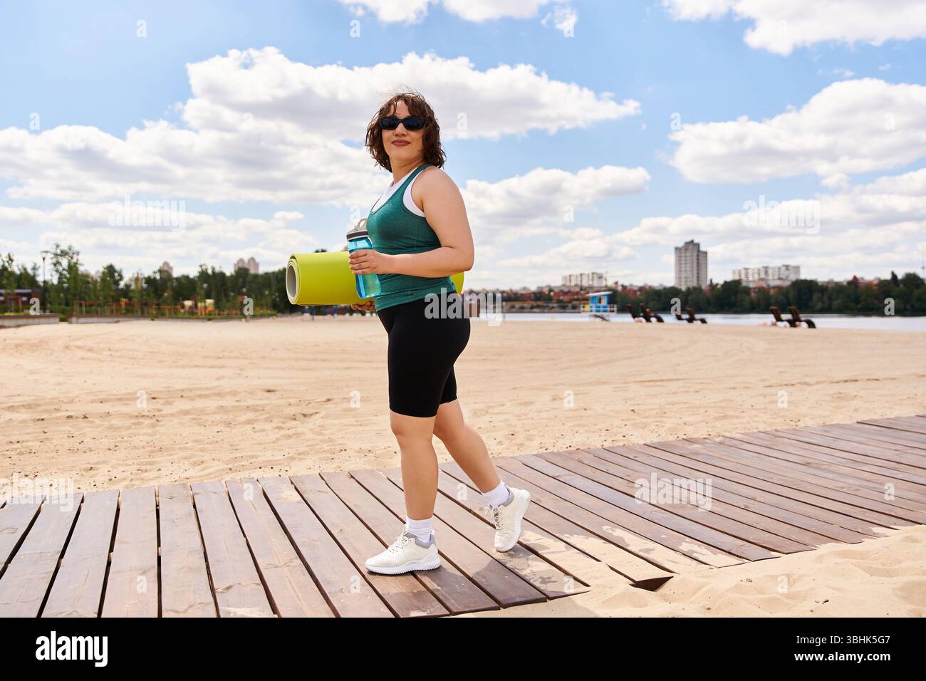Beautiful woman jogging along sandy hi-res stock photography and images ...