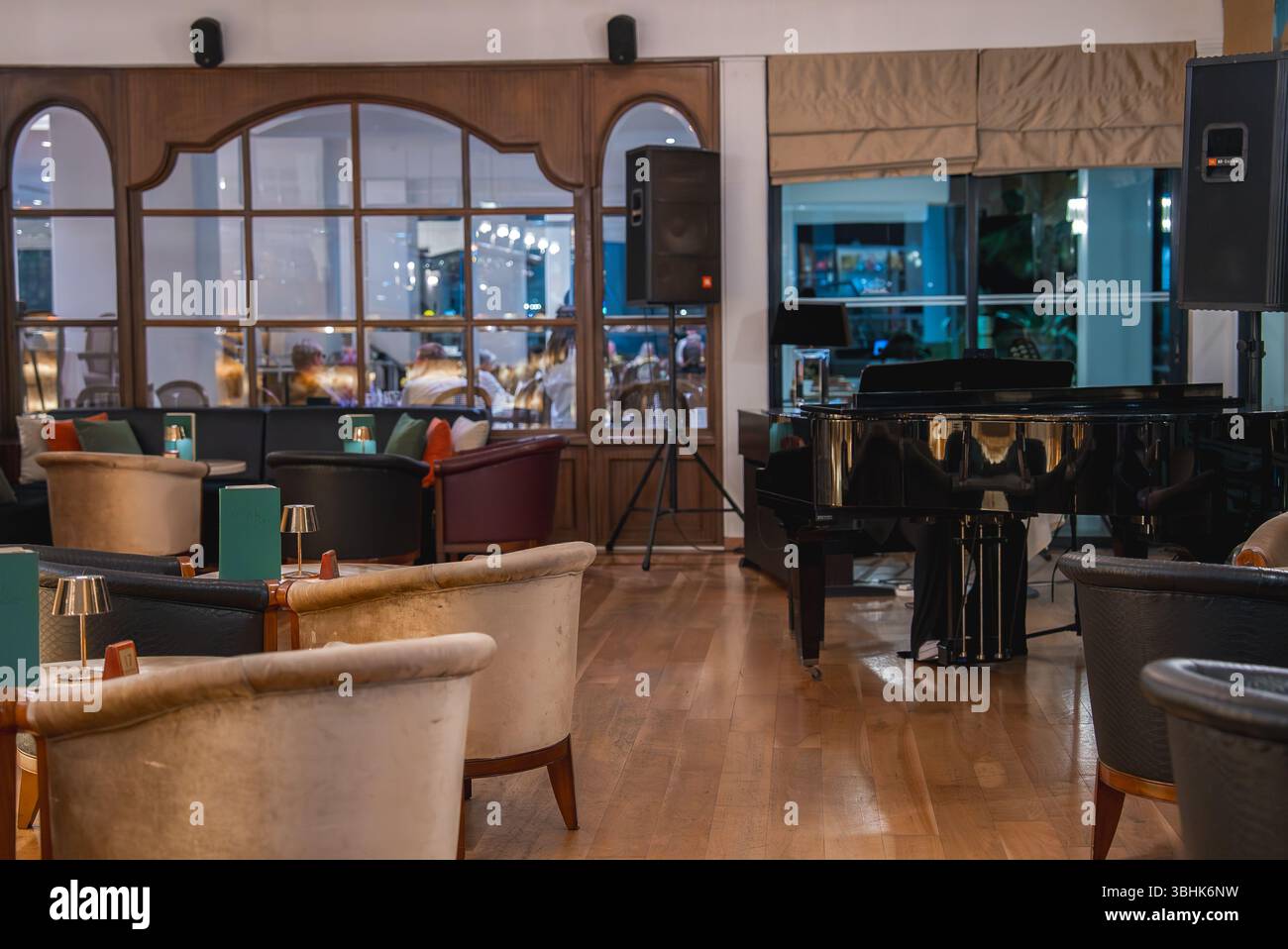 Elegant Lounge with Grand Piano and Arched Window in Cyprus Resort ...