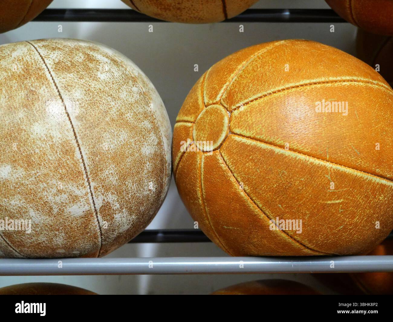 Old medicine balls made of leather, heavy, robust and versatile for ...