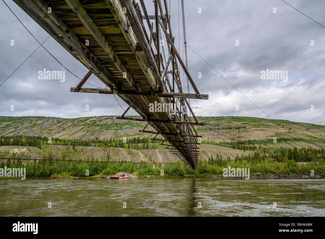The historic Canon Pipeling bridge and the Pelly River vehicle ferry at ...