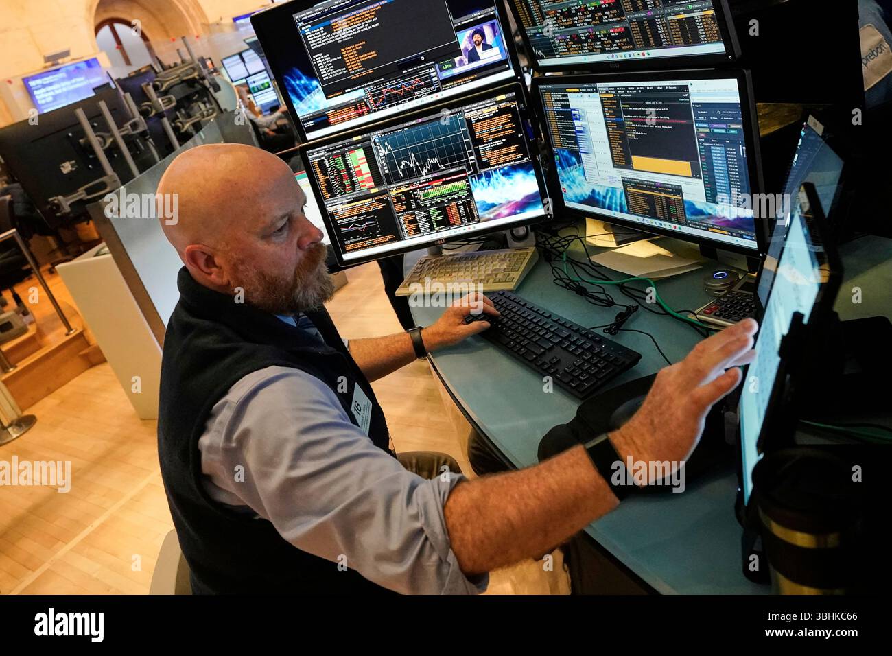 Trader Steven Gohl works on the floor of the New York Stock Exchange ...