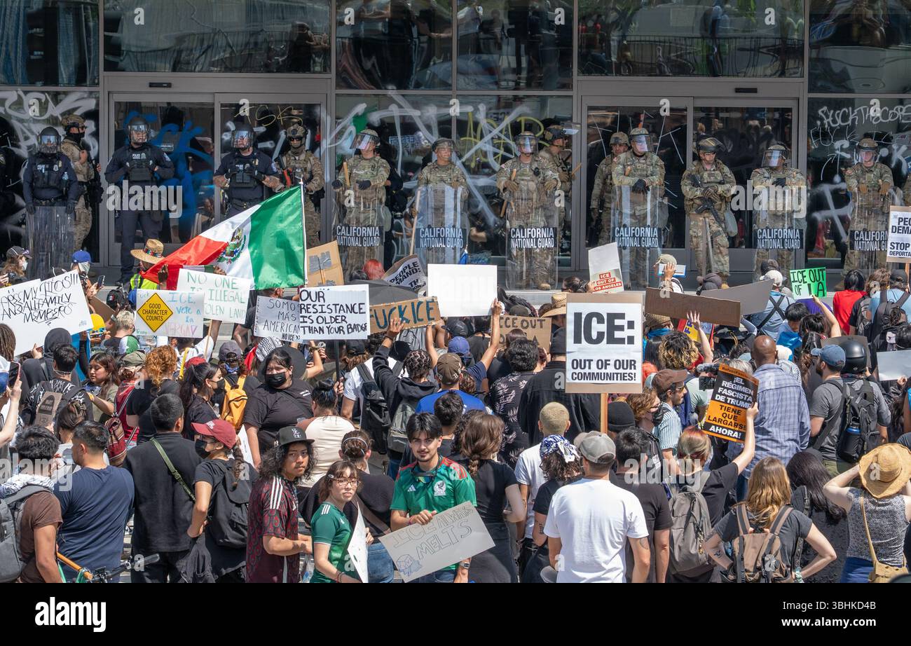 Protesters swarm through downtown Los Angeles with homemade signs and ...