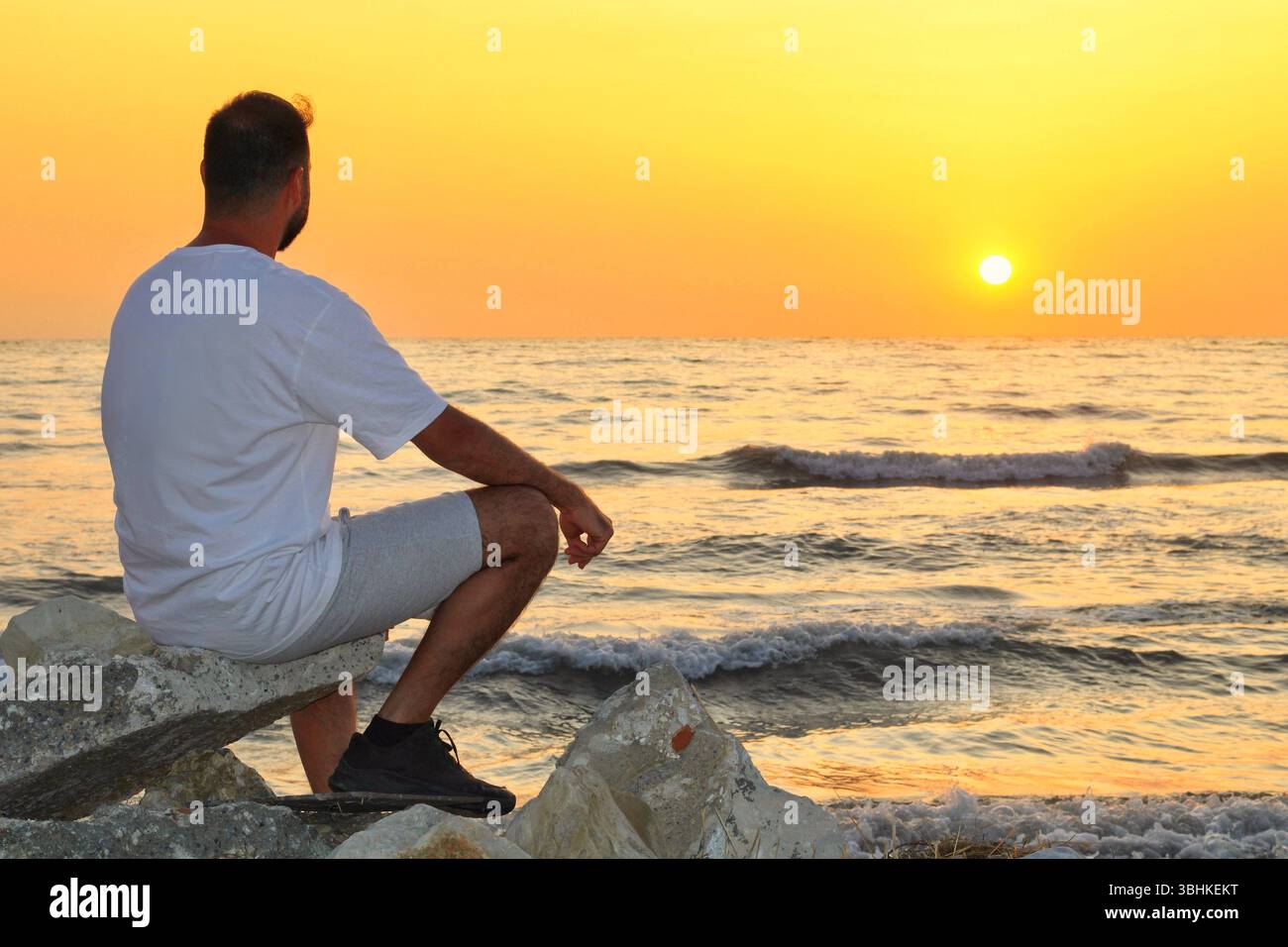Golden hour man gazing sunset hi-res stock photography and images - Alamy