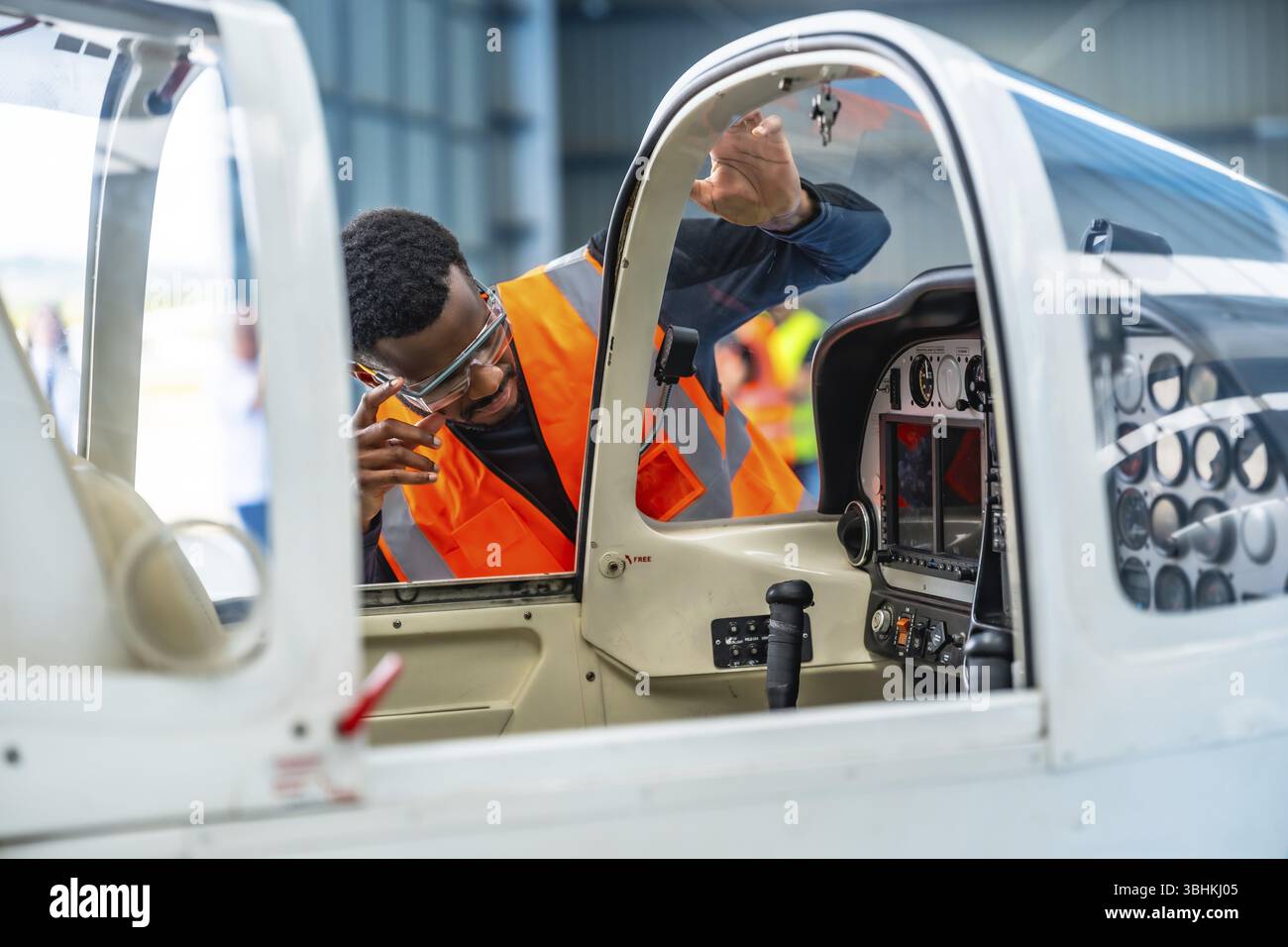 Engineer wearing safety glasses inspects hi-res stock photography and ...