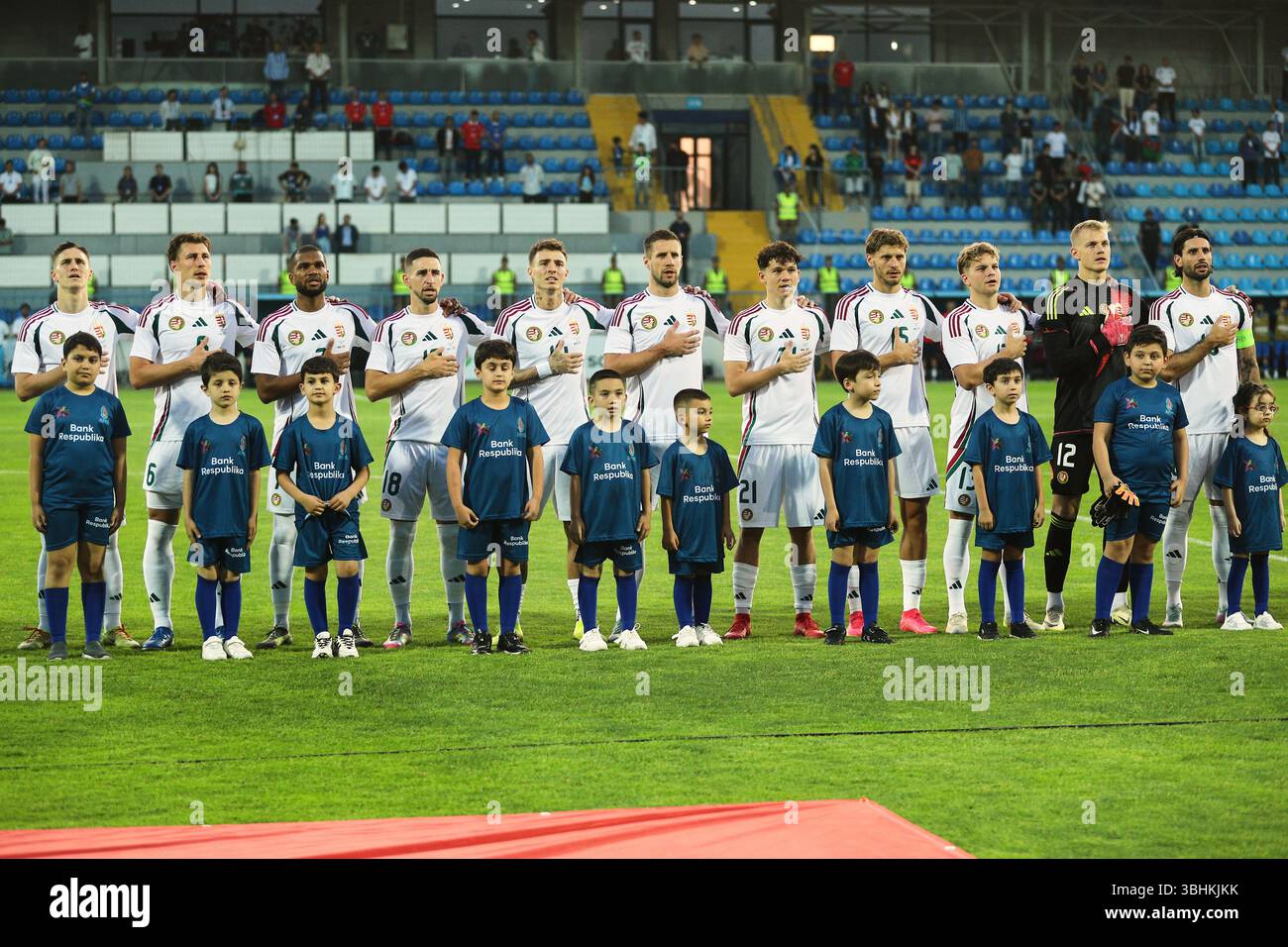 Hungary players line up before for the national anthem before an ...