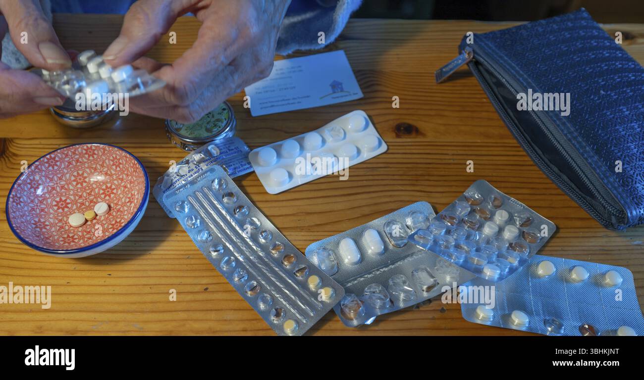 Daily compilation of medication at the dining table, Basyern, Germany ...