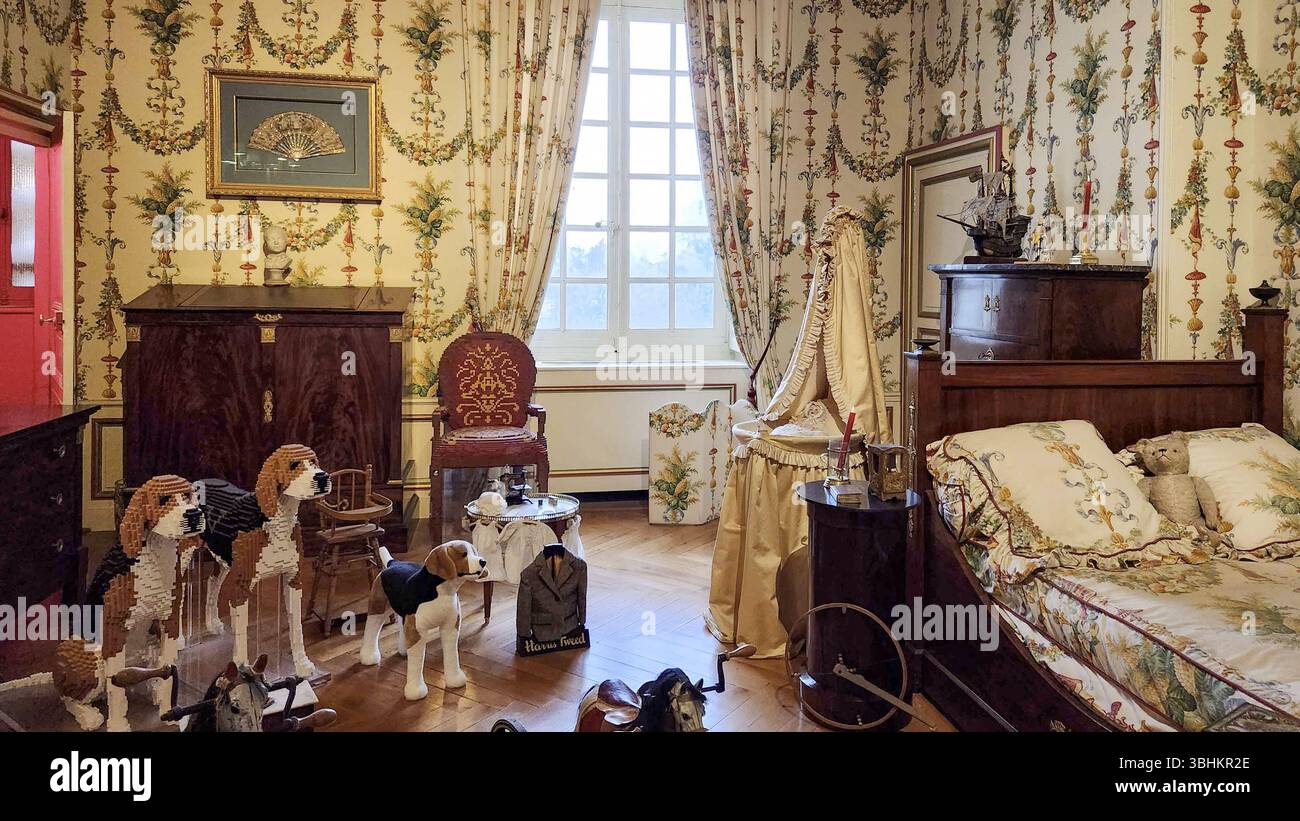 Opulent bedroom showcases canopied bed with rich tapestries and ...