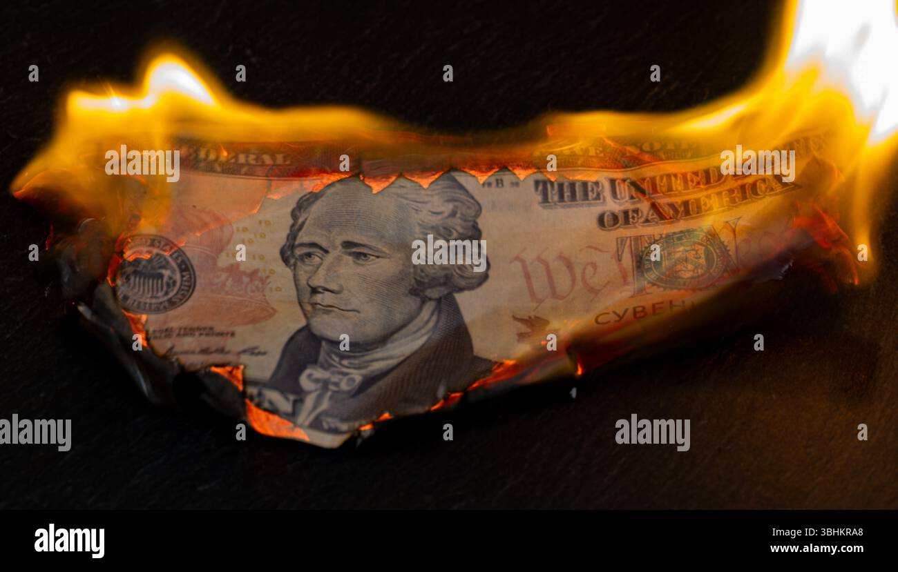 Burning US Ten Dollar Bill Stock Photo - Alamy