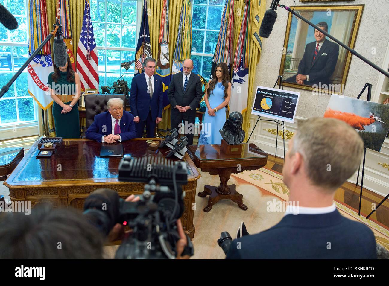 President Donald Trump speaks with reporters in the Oval Office of the ...