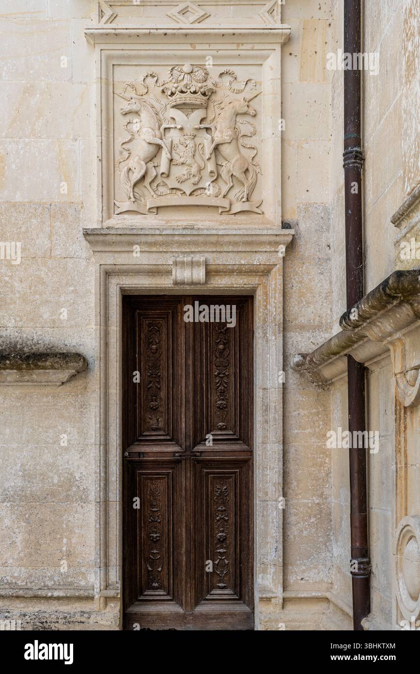 Ornate stone relief displays elaborate Renaissance heraldic coat of ...