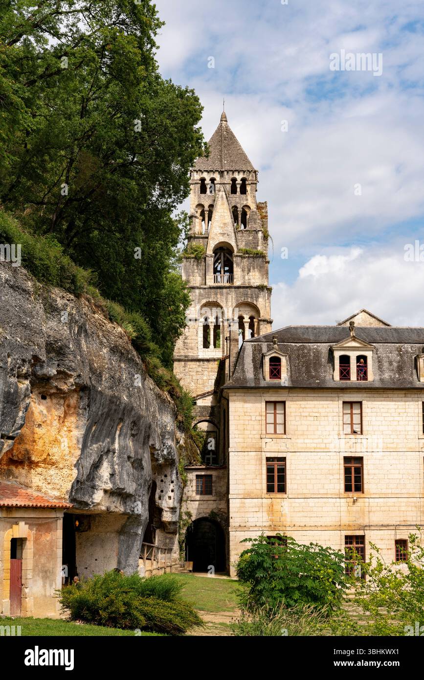Historic abbey bell tower and stone buildings with medieval ...