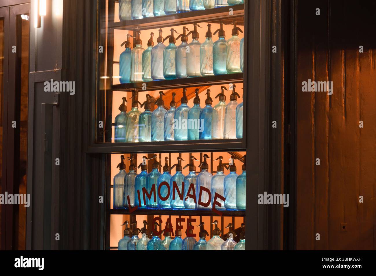 Display case with empty lemonade bottles in a bar in Lyon Stock Photo ...