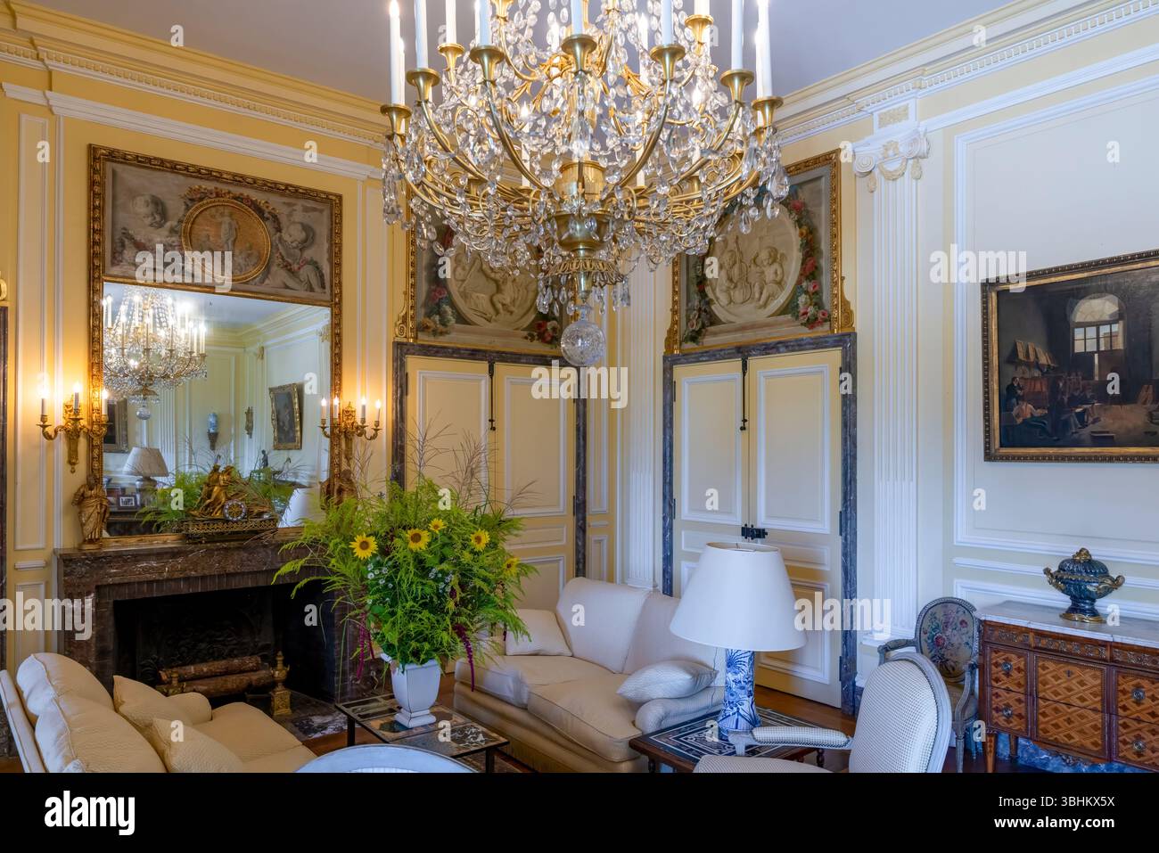 Elegant castle salon with crystal chandelier and period furniture ...