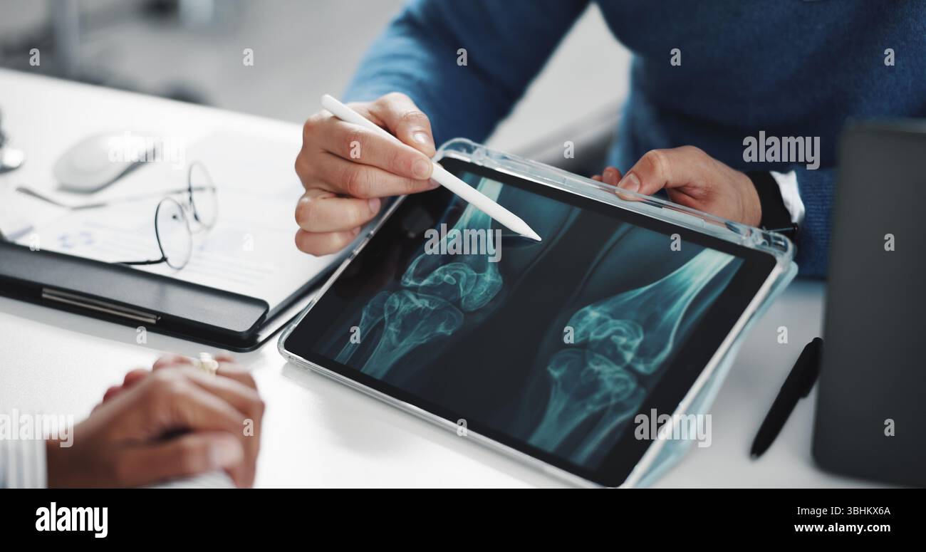 Doctor, patient and hands on tablet screen for knee x ray with injury ...