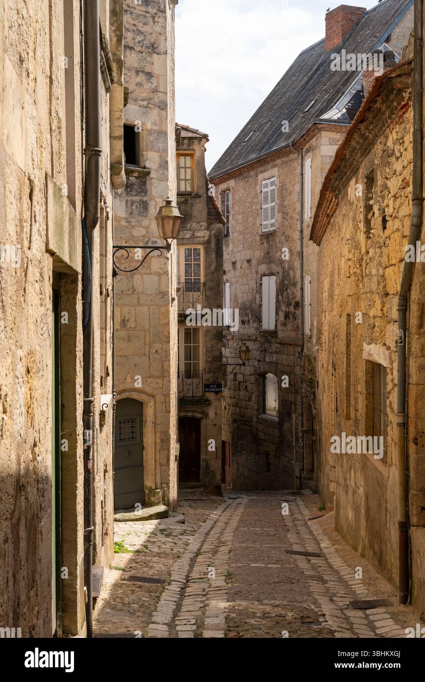 Medieval stone street with historic buildings and narrow cobblestone ...