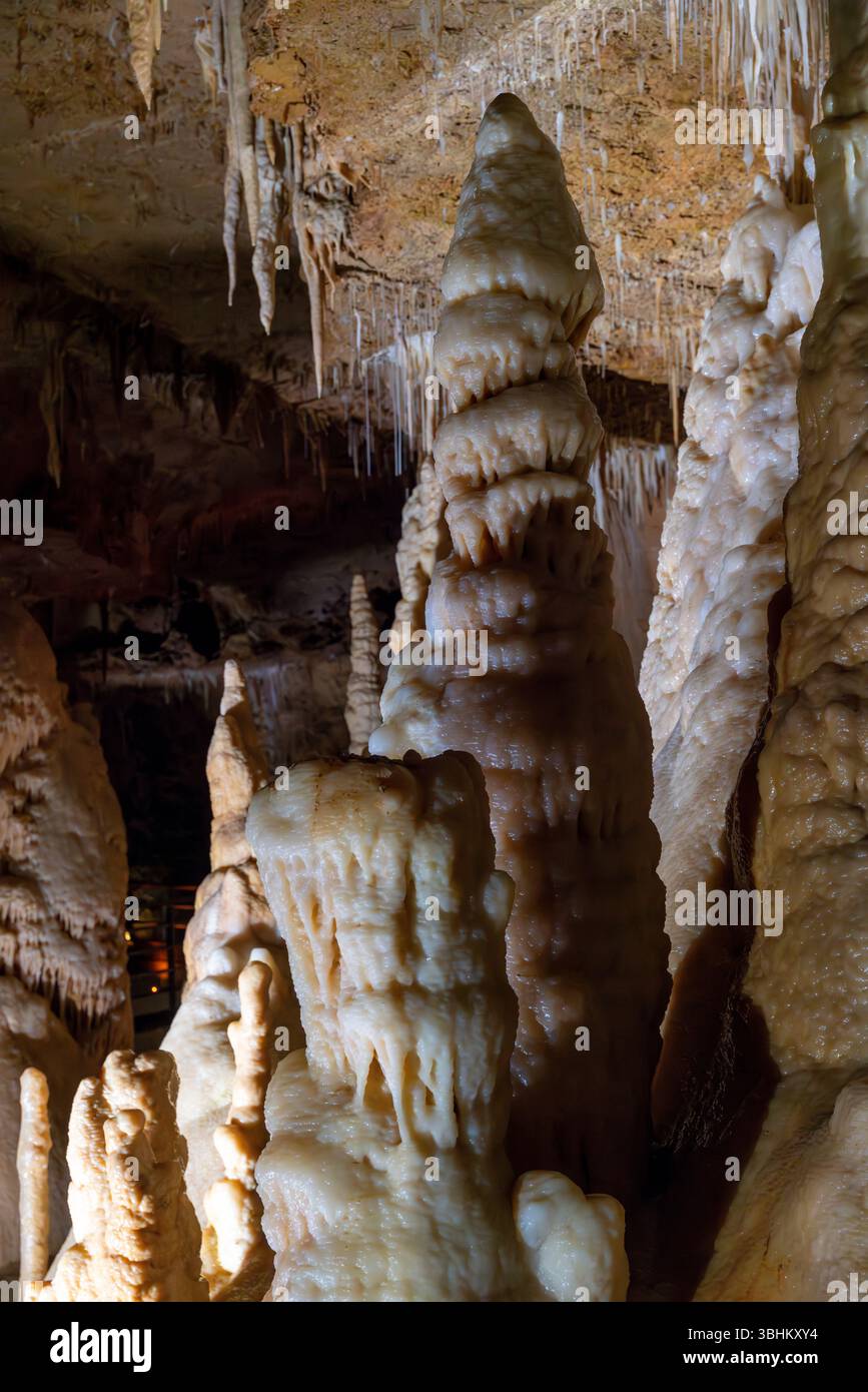 Ancient limestone columns and stalactites forming impressive geological ...