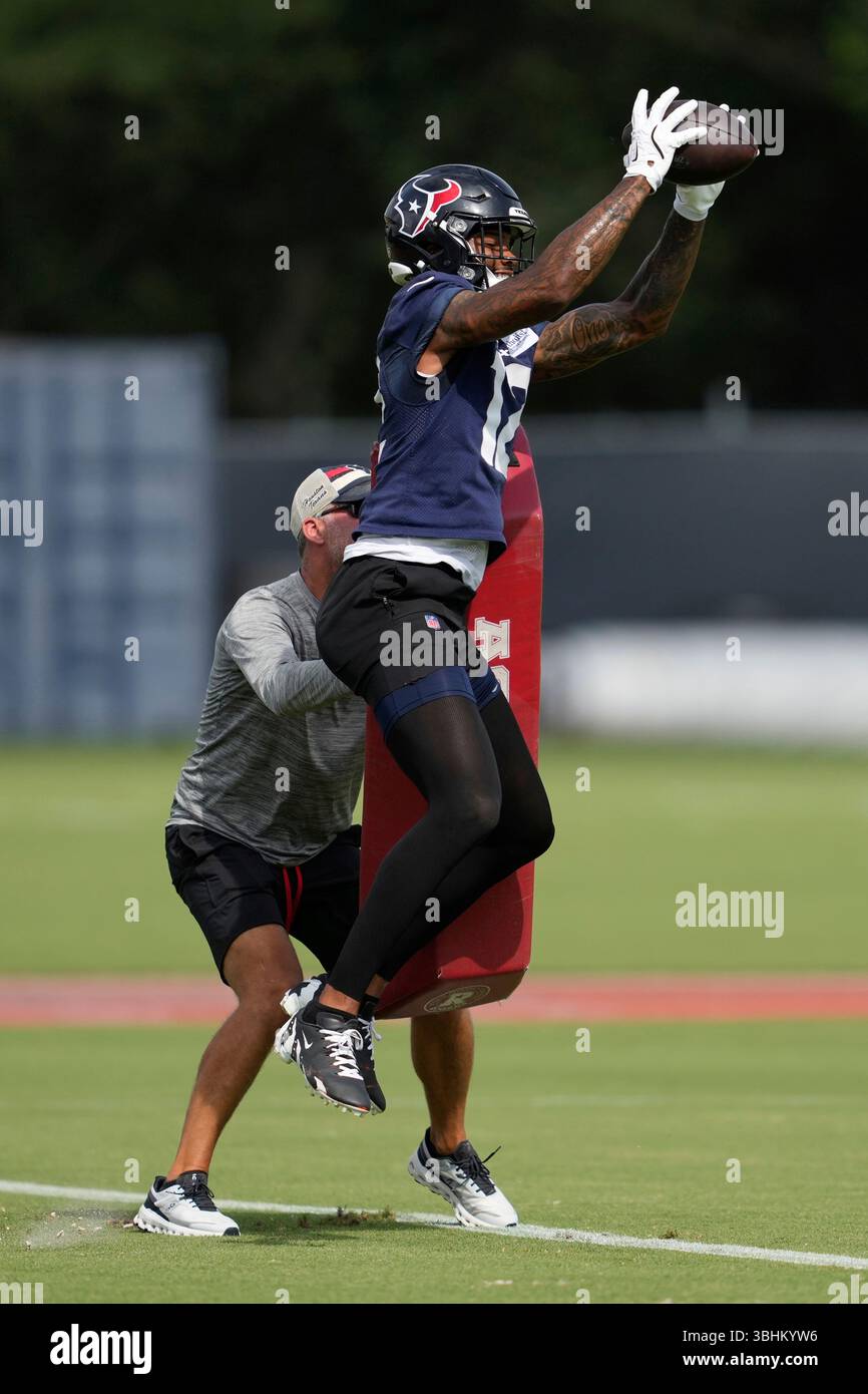 Houston Texans wide receiver Nico Collins (12) works out during an NFL ...