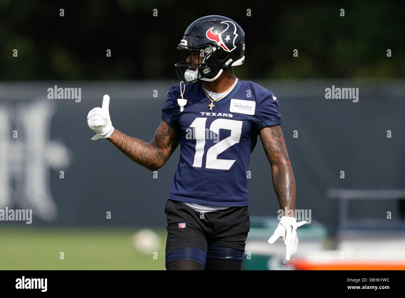 Houston Texans wide receiver Nico Collins (12) works out during an NFL ...