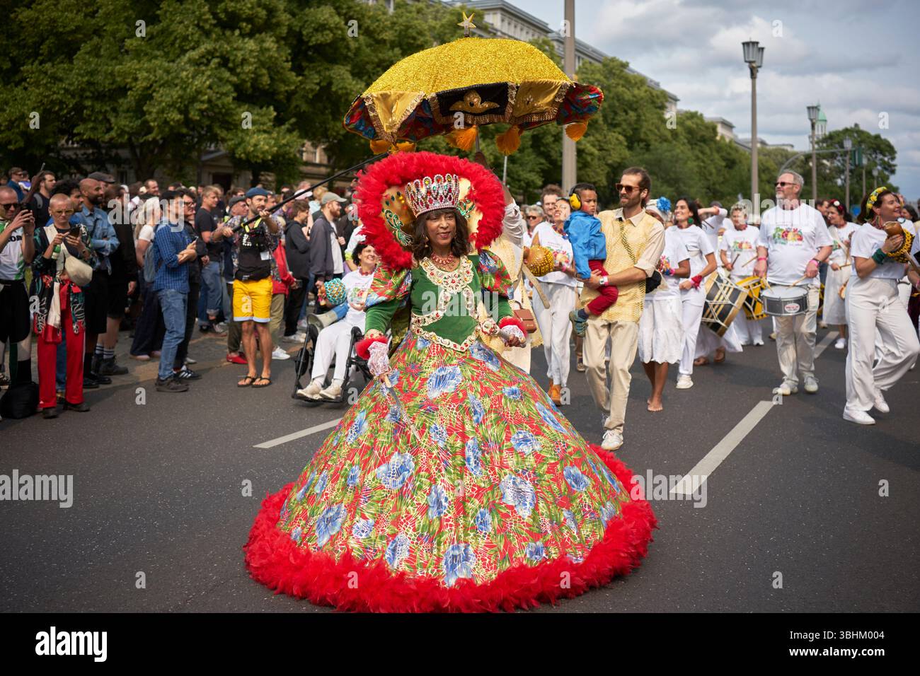 A woman in traditional dress shows herself during the parade of ...