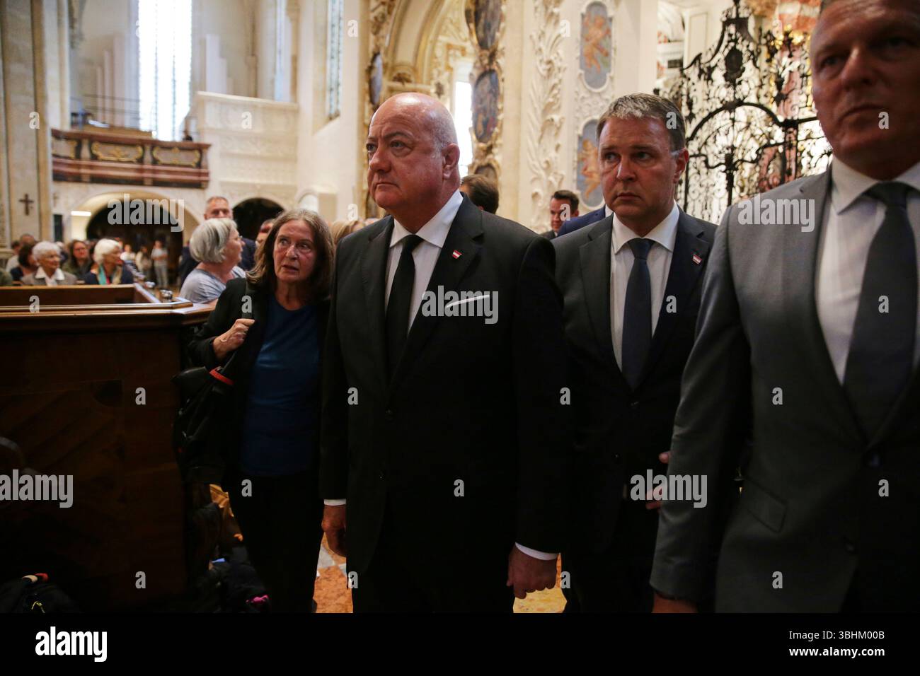 Austria's Chancellor Christian Stocker, center left, arrives with other ...