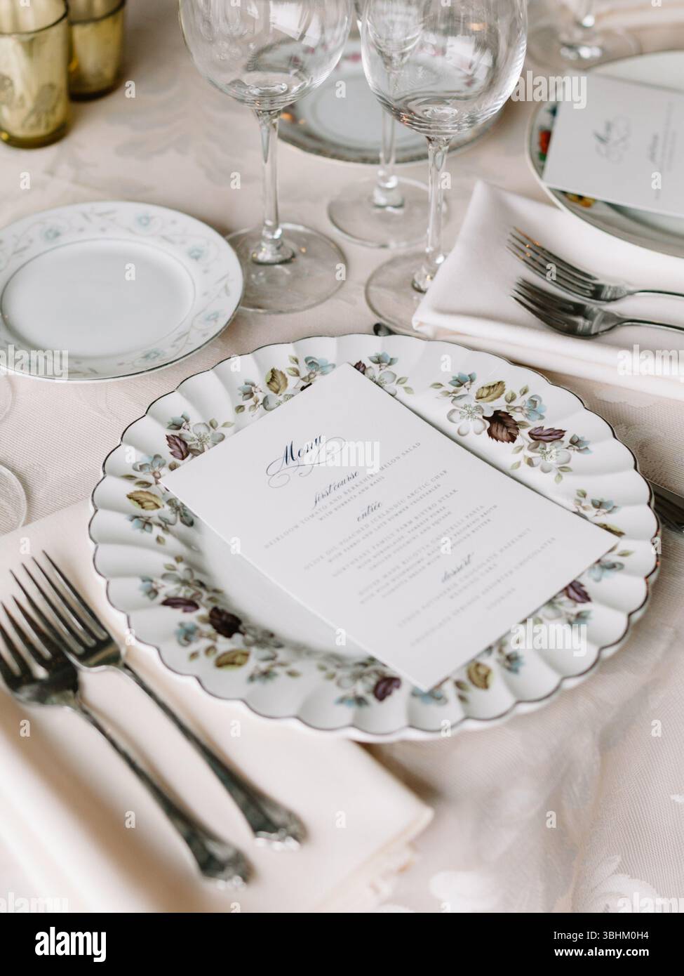 A beautifully arranged dining table features floral china, polished ...