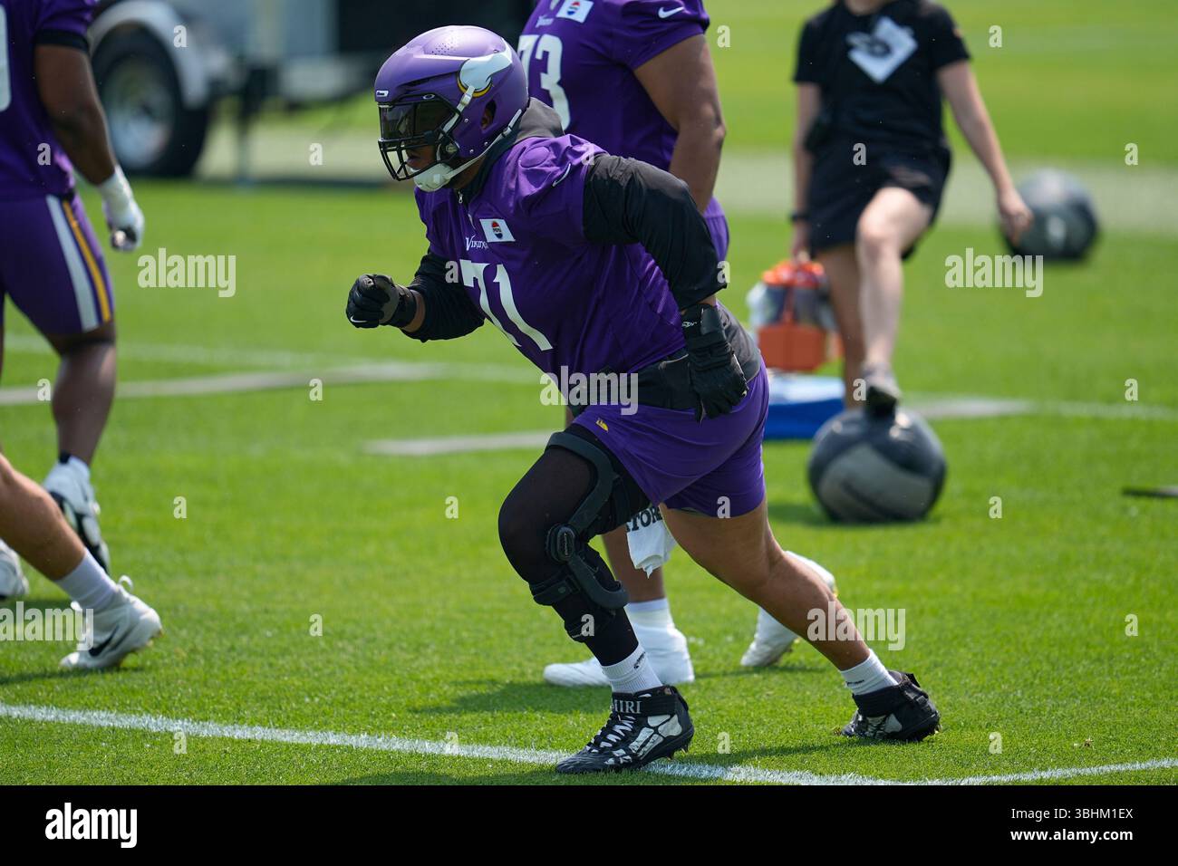 Minnesota Vikings offensive tackle Christian Darrisaw (71) takes part ...