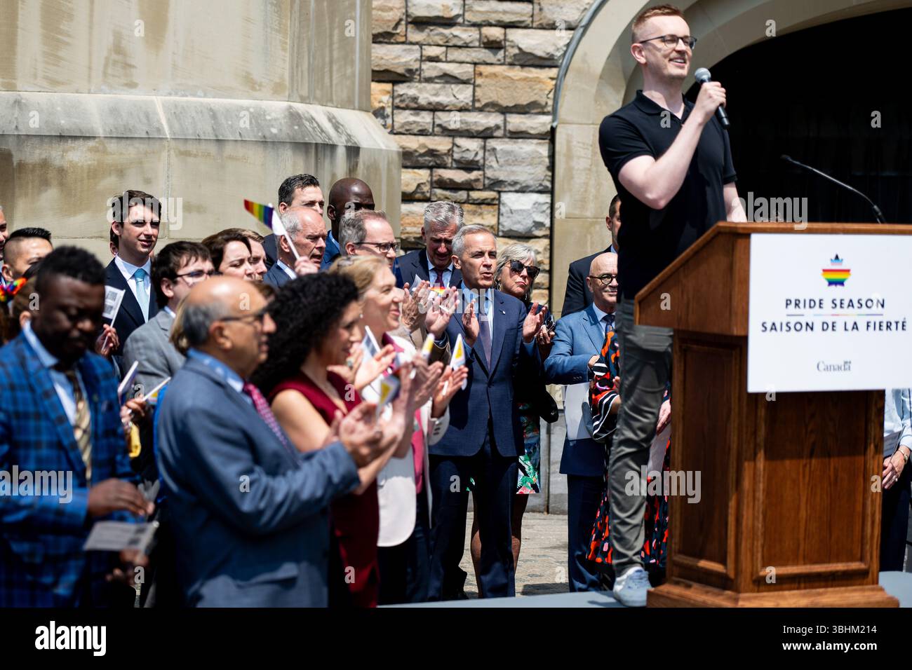 Prime Minister Mark Carney claps during the singing of 'O-Canada ...