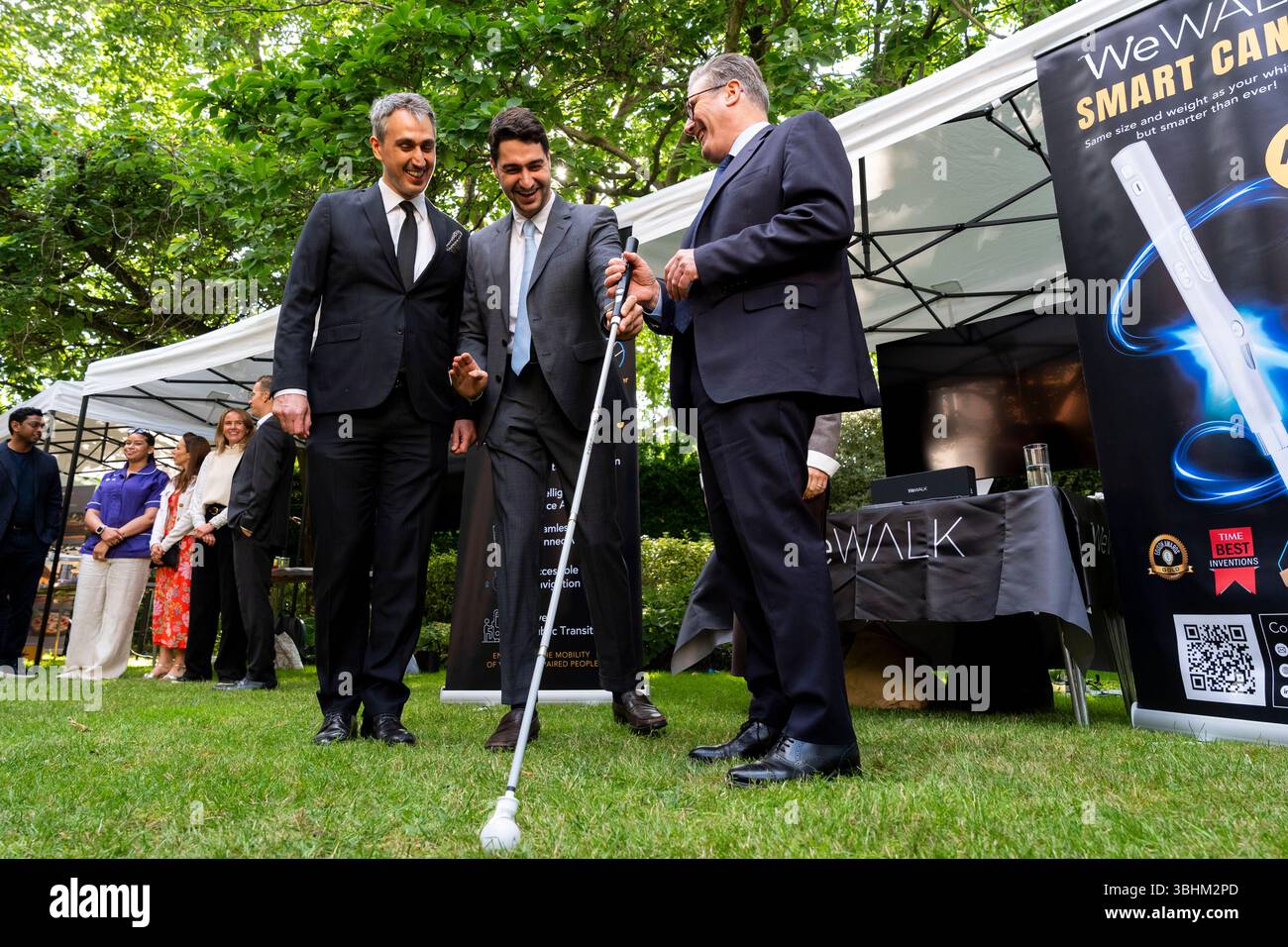 Prime Minister Sir Keir Starmer (right) speaks to Jean Marc Feghali ...