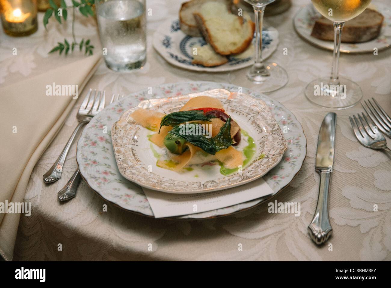 A gourmet dish featuring colorful vegetables presented elegantly on ...