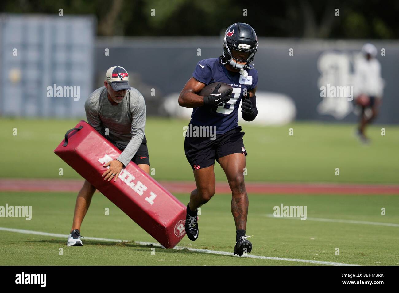 Houston Texans wide receiver John Metchie III (8) works out during an ...