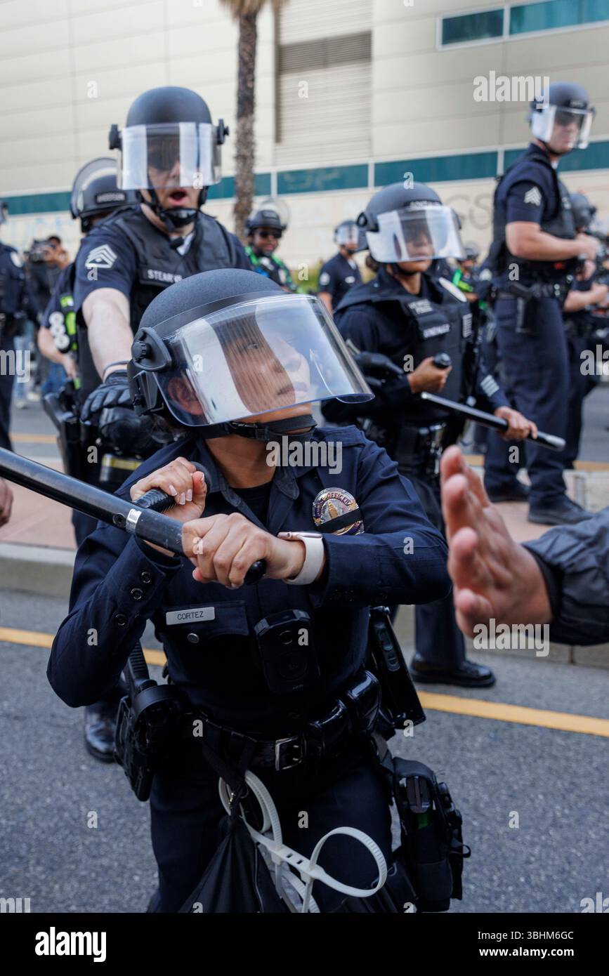 Los Angeles, USA. 09th June, 2025. LAPD Officer Cortez is restrained by ...
