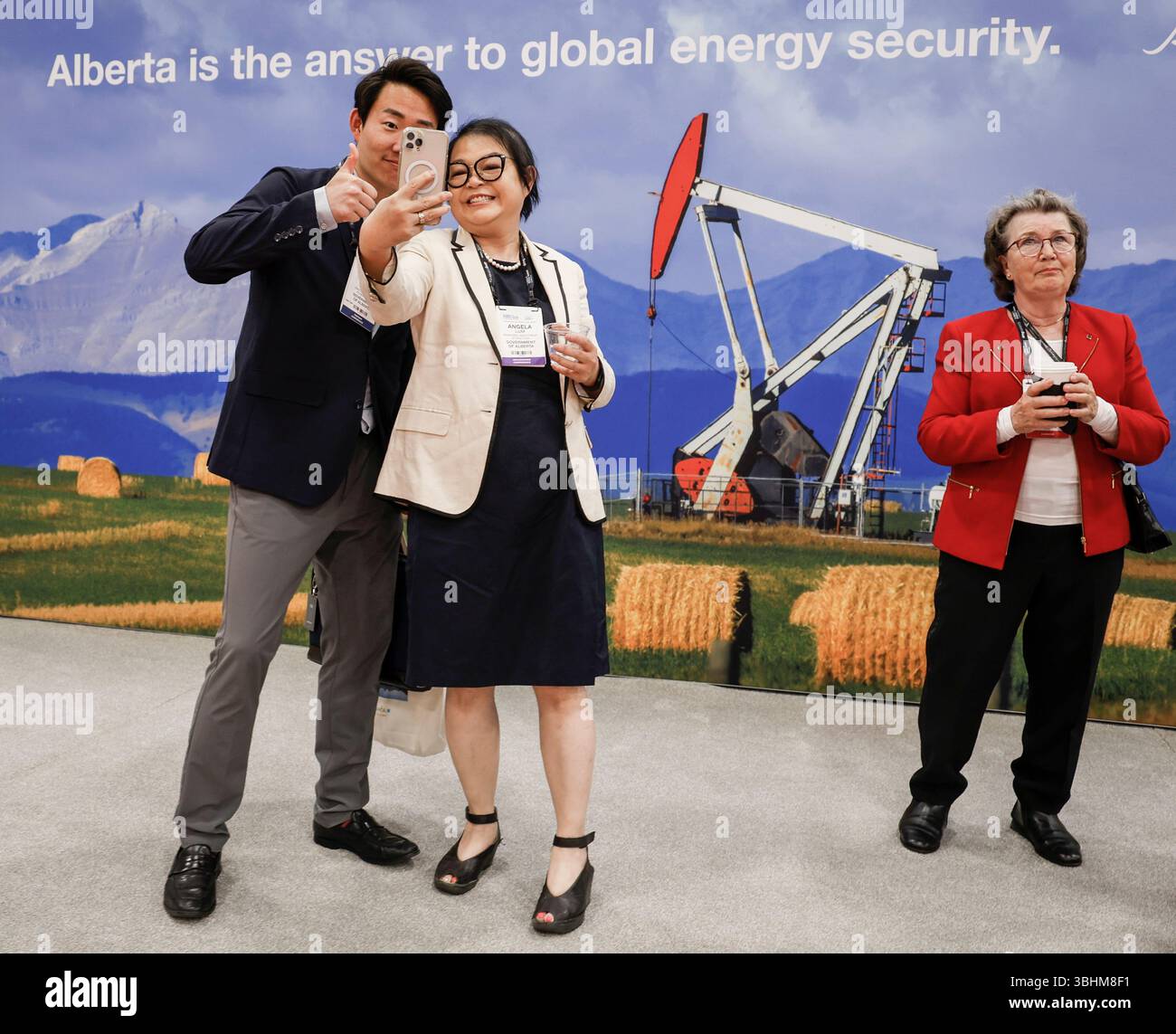 Calgary, Canada. 10th June, 2025. Delegates take selfies in front of an ...