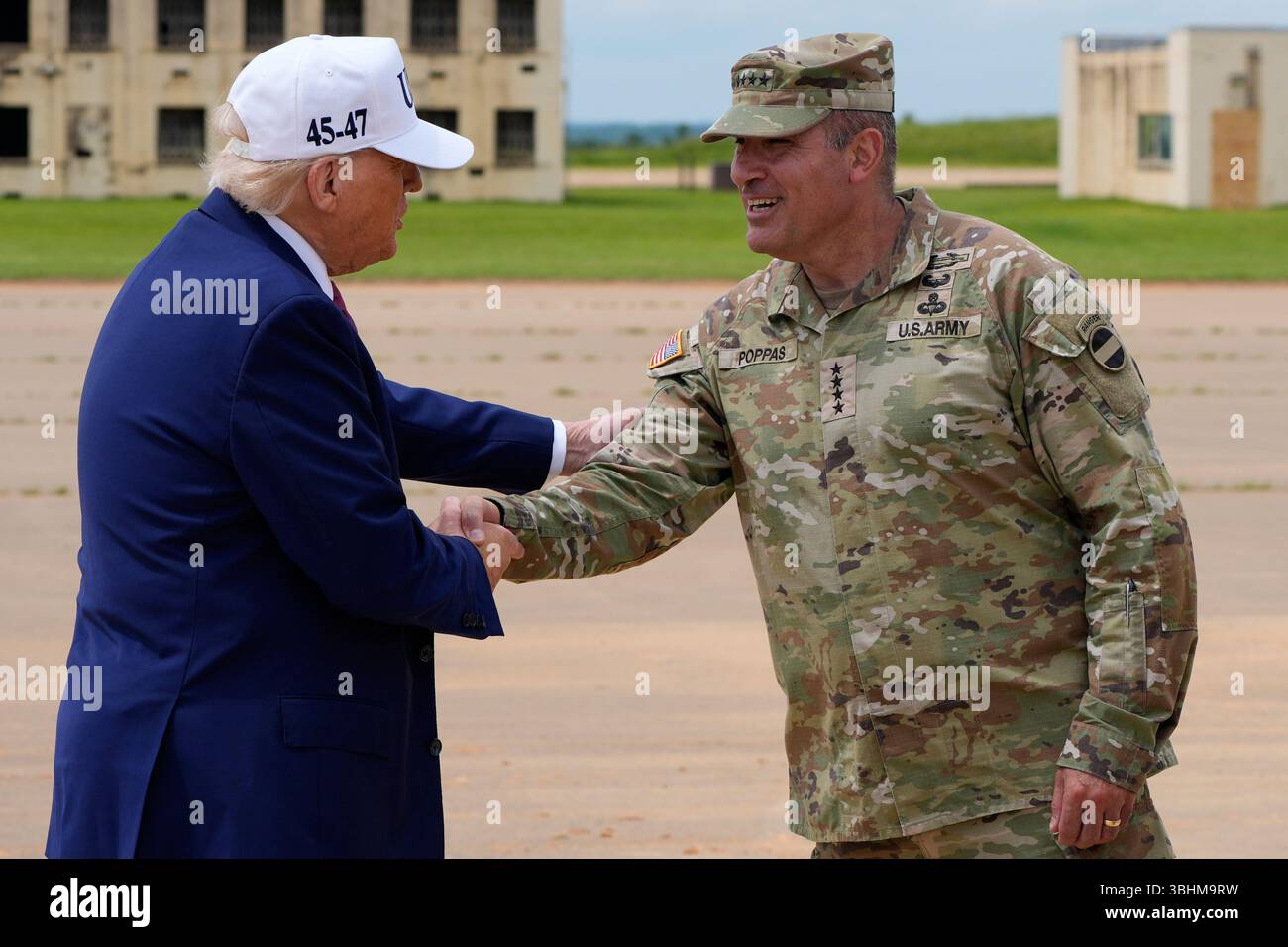 President Donald Trump greets Gen. Andrew Poppas, commander of the U.S ...