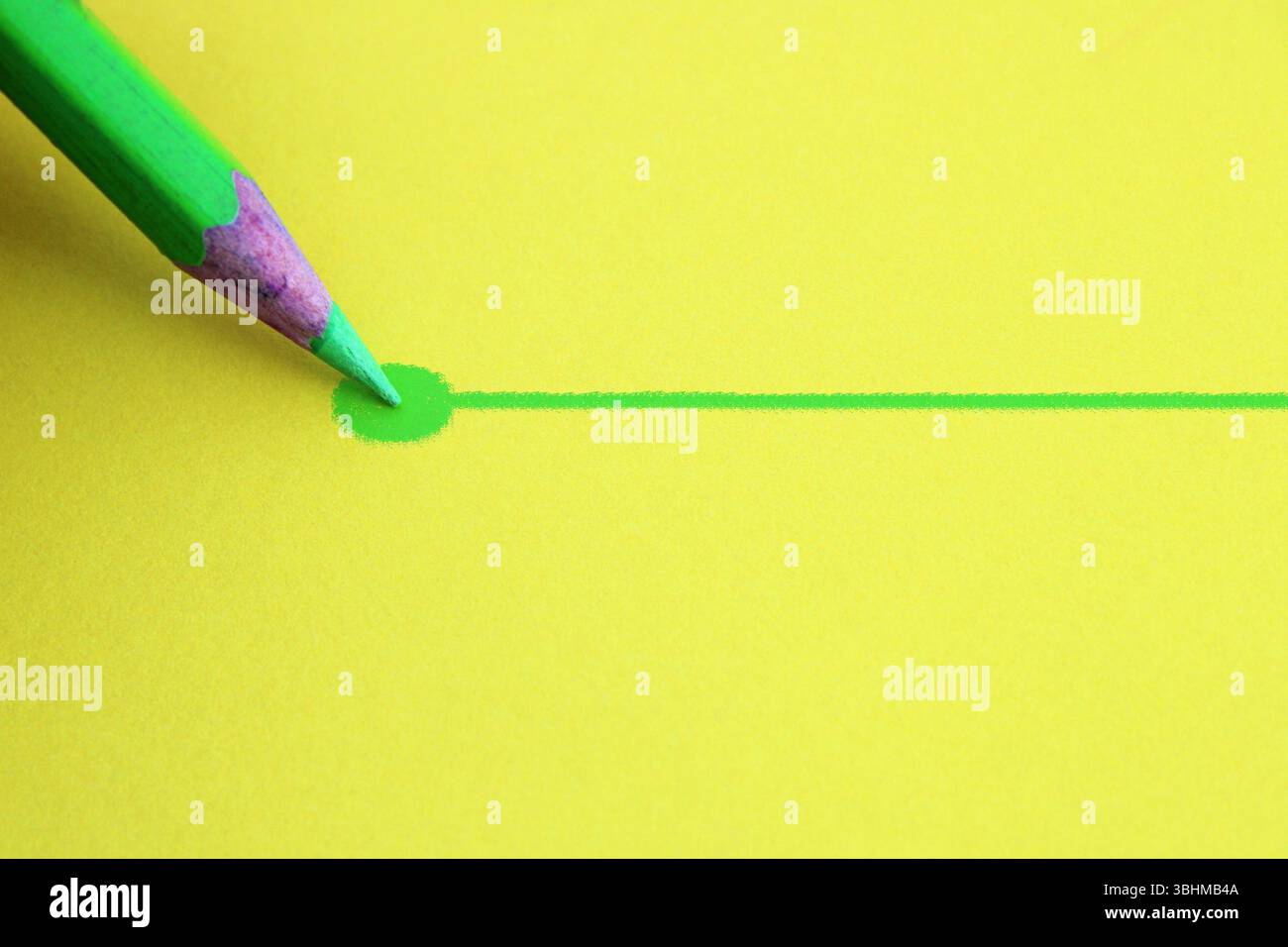 Light green pencil drawing a line that ends in a point Stock Photo - Alamy