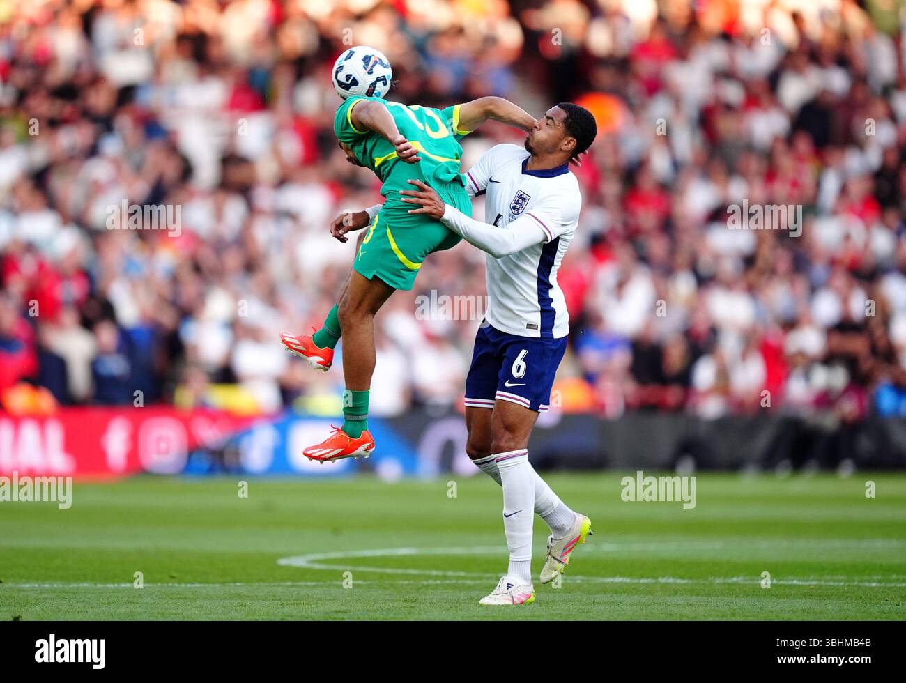 Senegal's Iliman-Cheikh Ndiaye (left) and England's Levi Colwill battle for the ball during the ...
