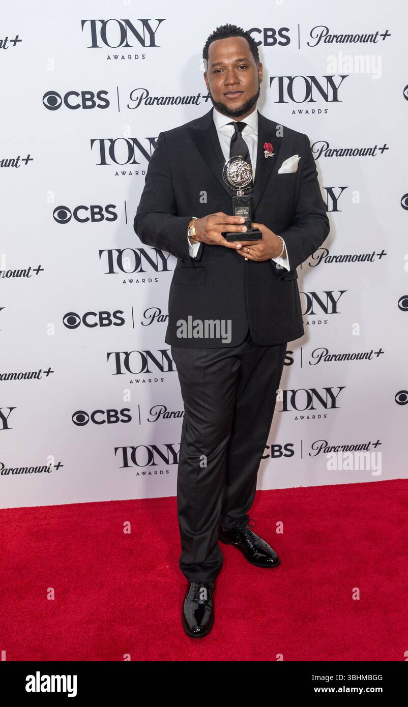 Branden Jacobs-Jenkins poses with the Best Play award for 'Purpose' at ...