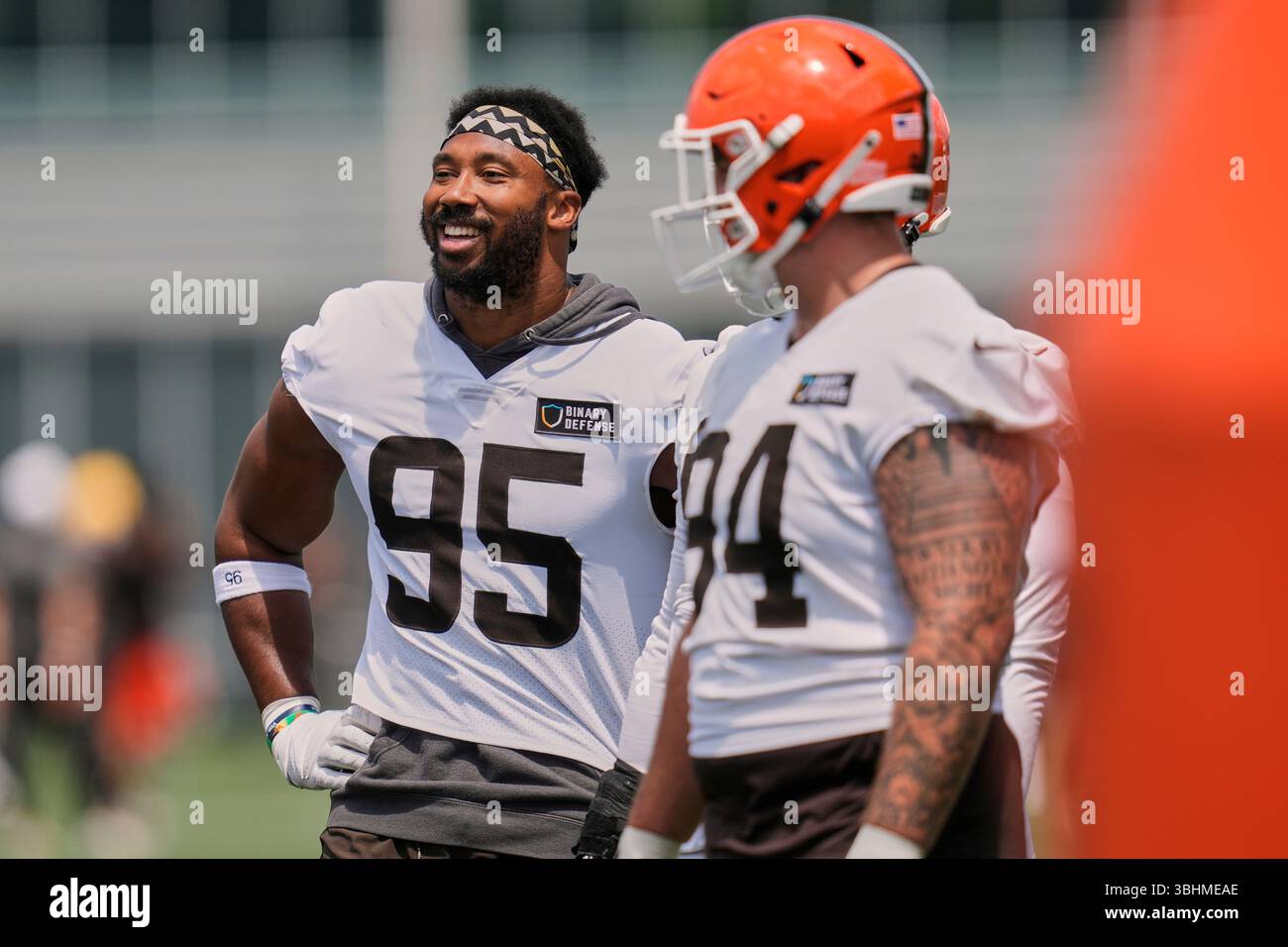 Cleveland Browns defensive end Myles Garrett (95) and defensive tackle Mason Graham (94) are ...