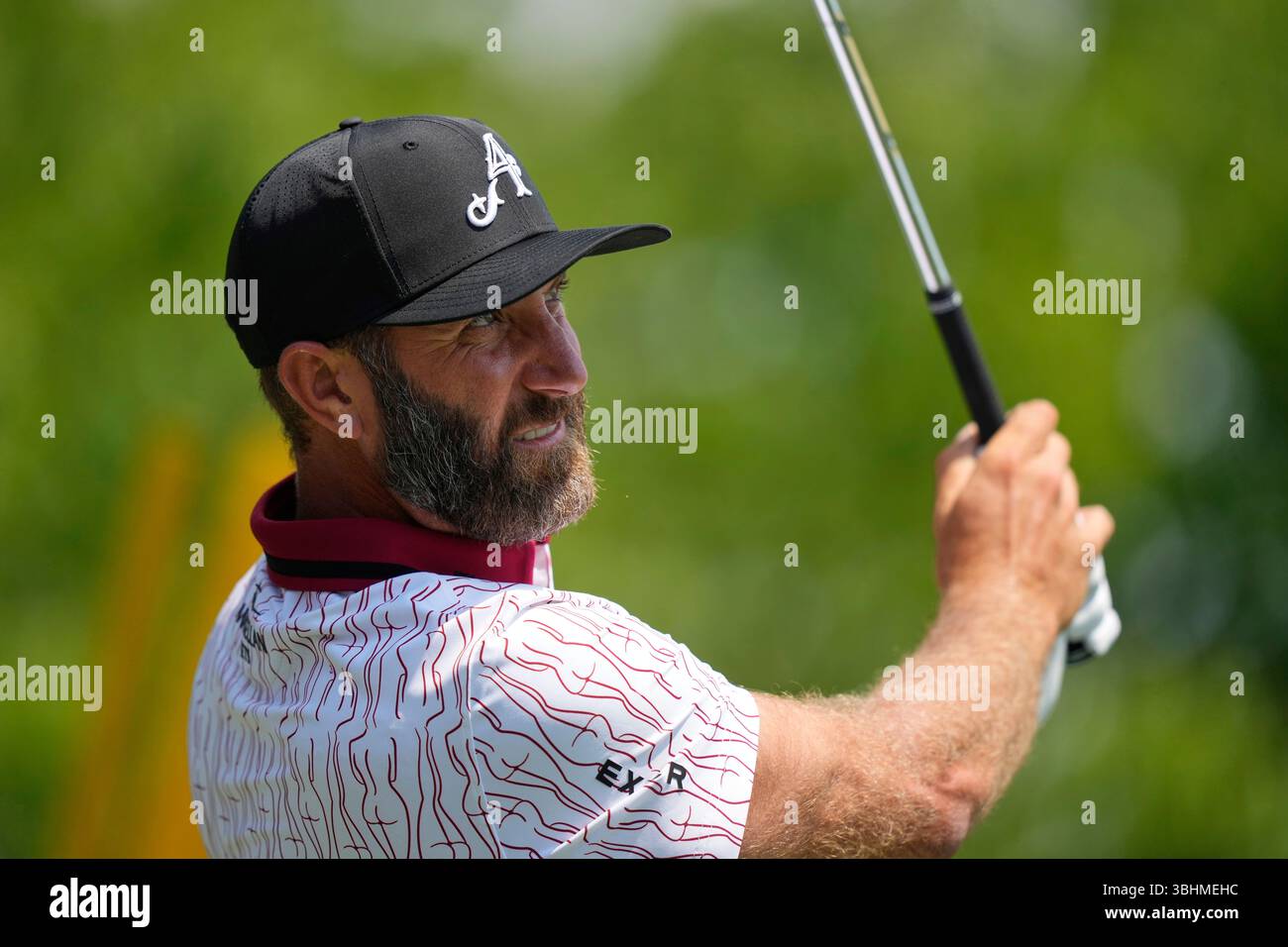 Dustin Johnson tees off on the 13th hole during a practice round ahead ...