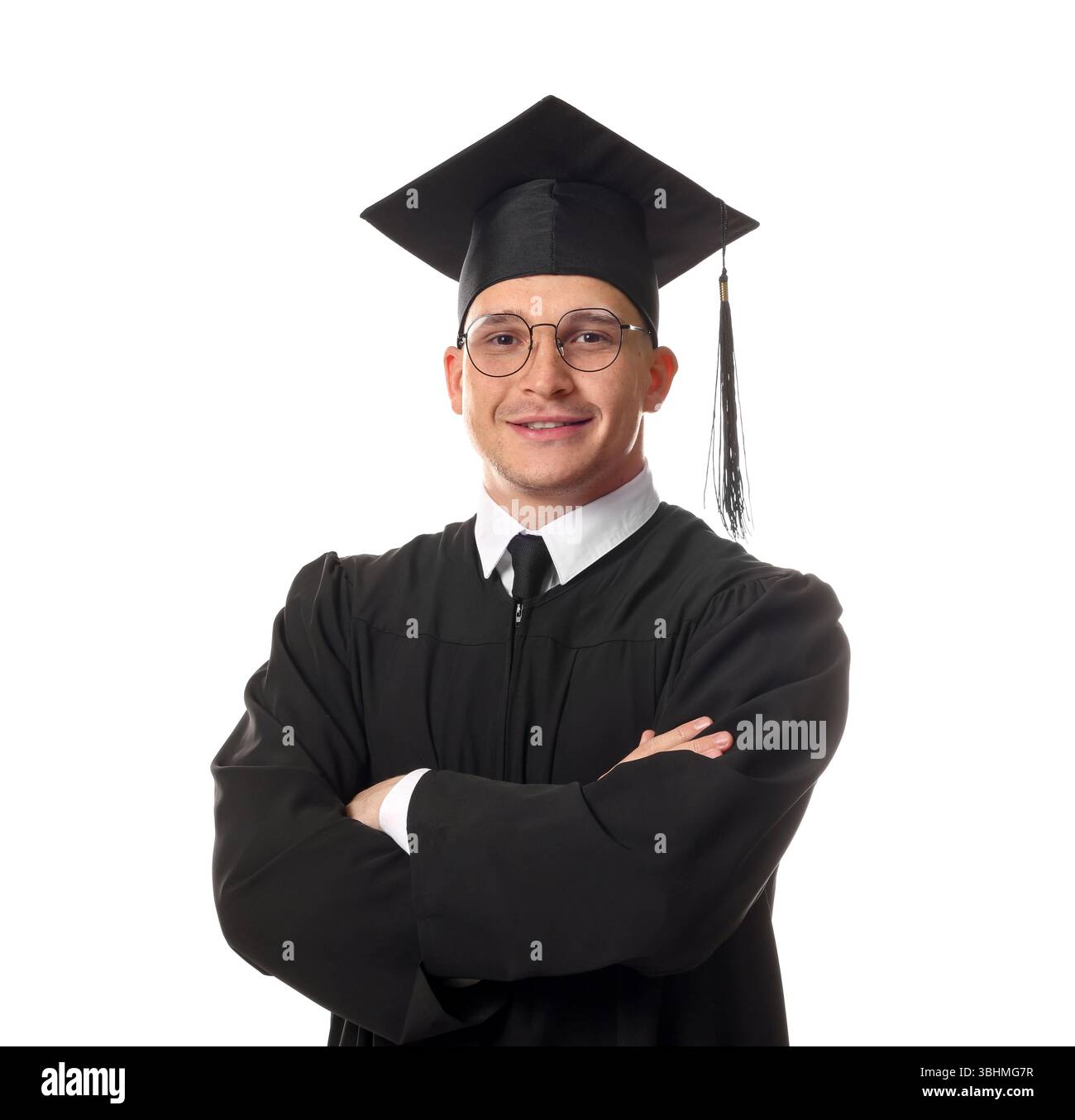 Happy student with crossed arms after graduation on white background ...