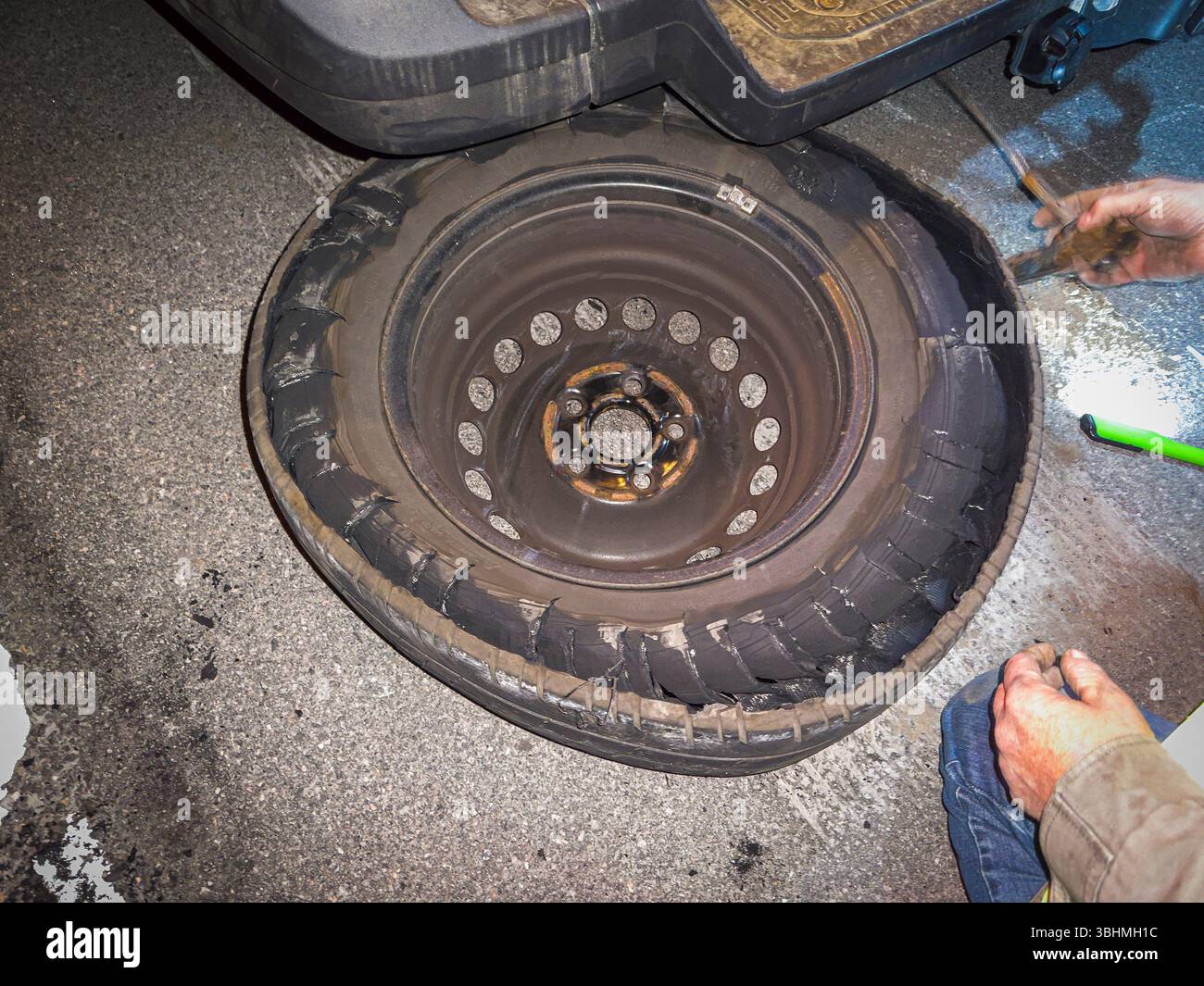 Illustrative photo, burst damaged retread tyre, tread, rear wheel ...